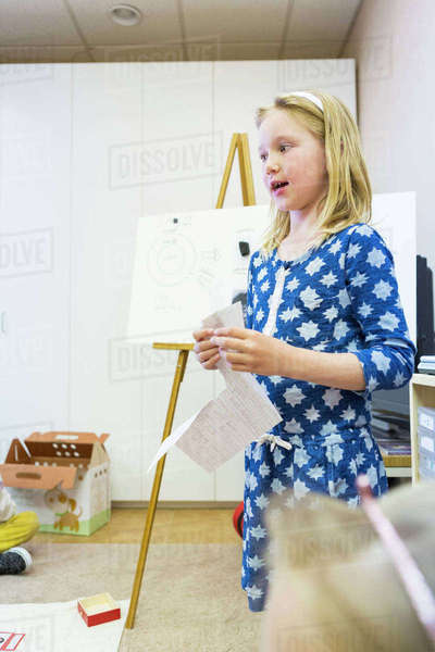 Caucasian girl giving presentation to classmates - Royalty-free Stock ...