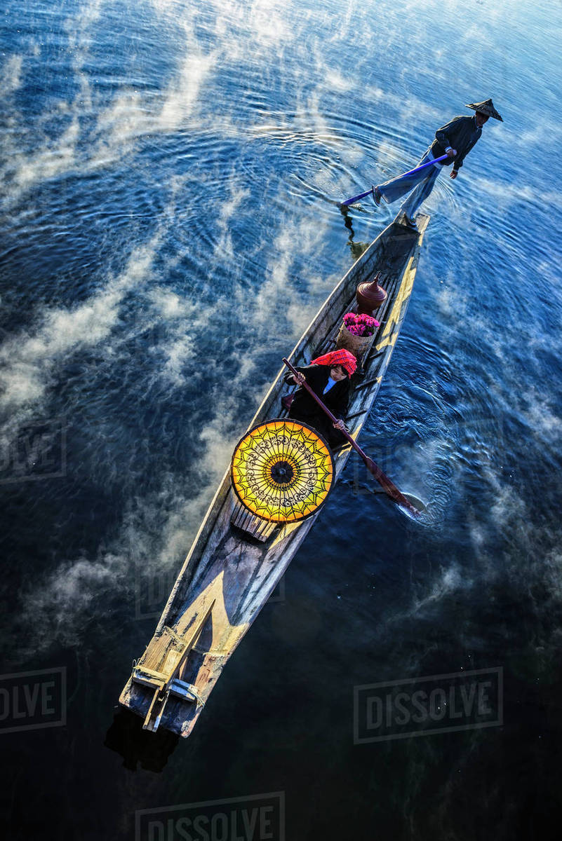 Asian father and daughter rowing in canoe on river - Royalty-free Stock ...