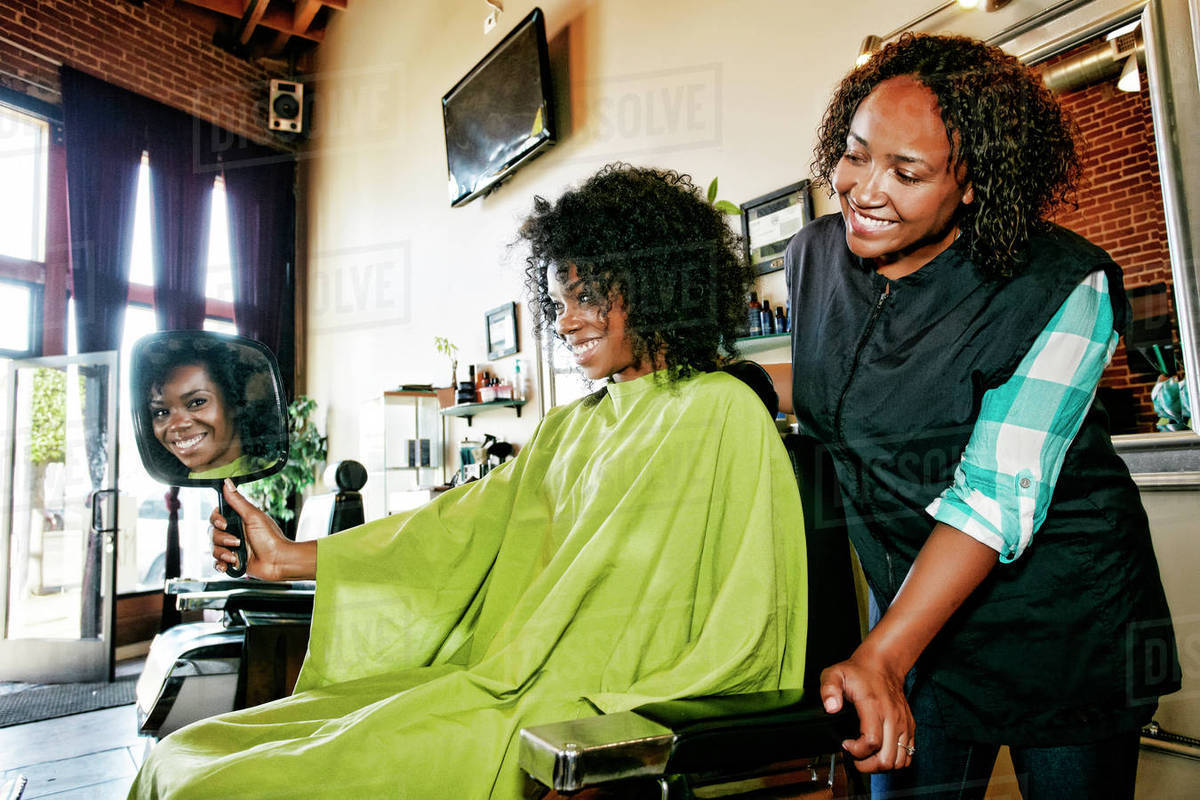 Smiling hairdresser and customer in hair salon - Royalty-free Stock ...