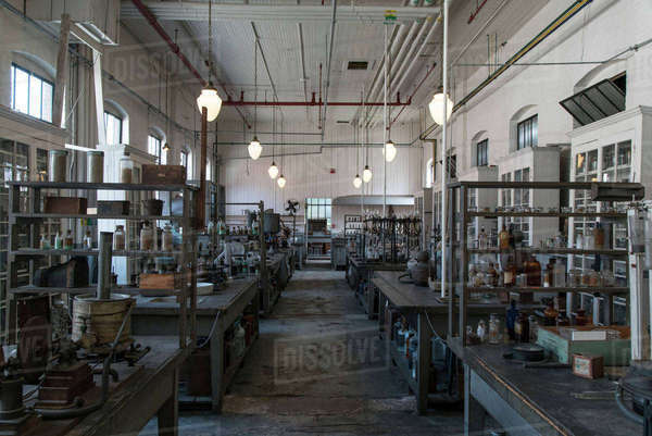 Tables and jars in empty old-fashioned factory - Royalty-free Stock ...