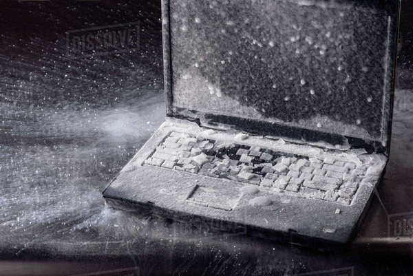Ice on frozen laptop - Royalty-free Stock Photo | Dissolve