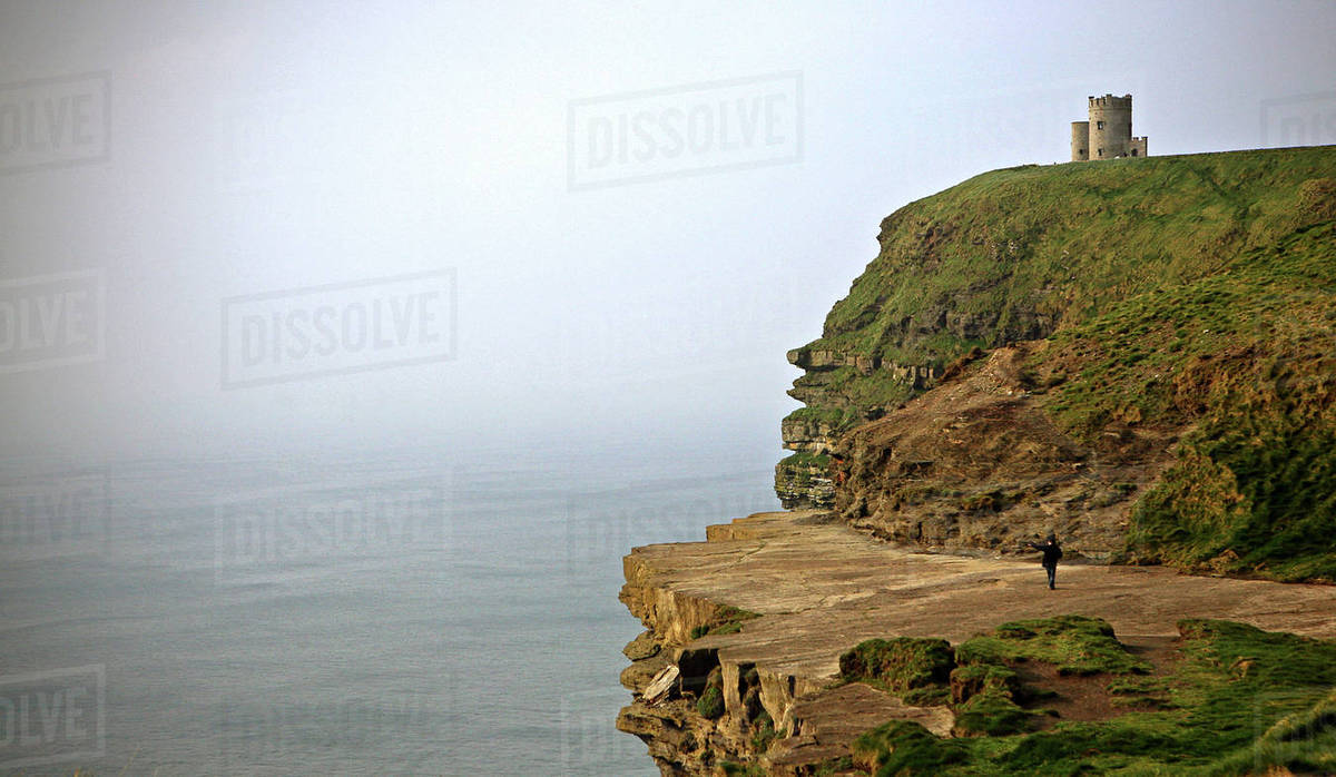 Castle on cliff near ocean - Royalty-free Stock Photo | Dissolve