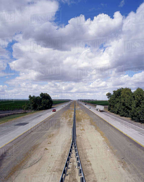 Barrier separating lanes on freeway - Royalty-free Stock Photo | Dissolve