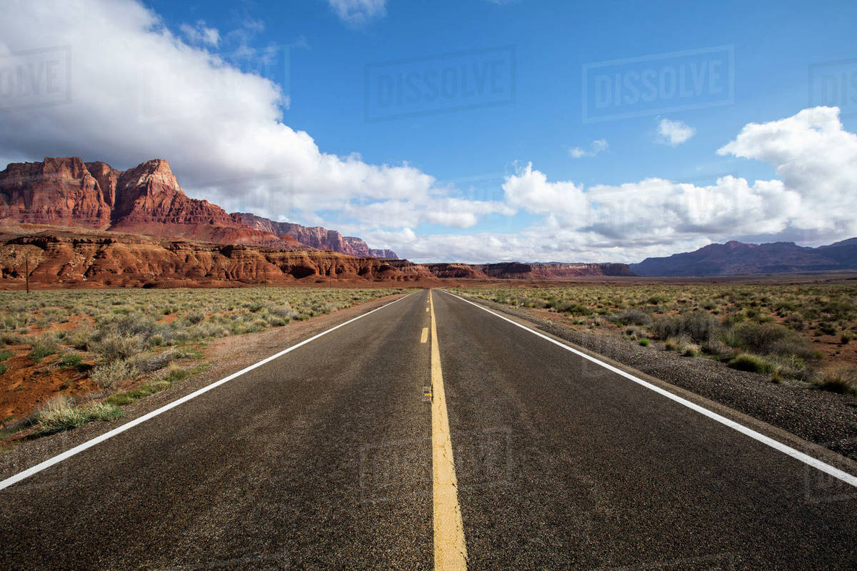 Road to distant desert landscape - Royalty-free Stock Photo | Dissolve