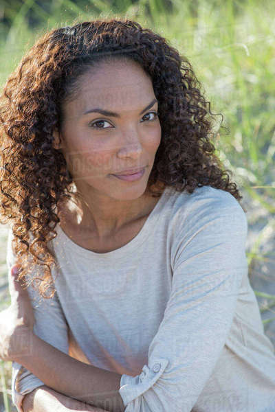 Portrait of smiling Mixed Race woman at beach - Royalty-free Stock ...