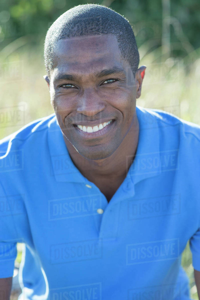 Portrait of smiling Black man - Royalty-free Stock Photo | Dissolve