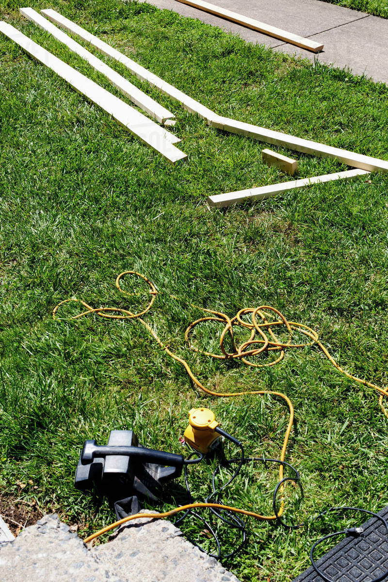 Tools laying in grass - Royalty-free Stock Photo | Dissolve