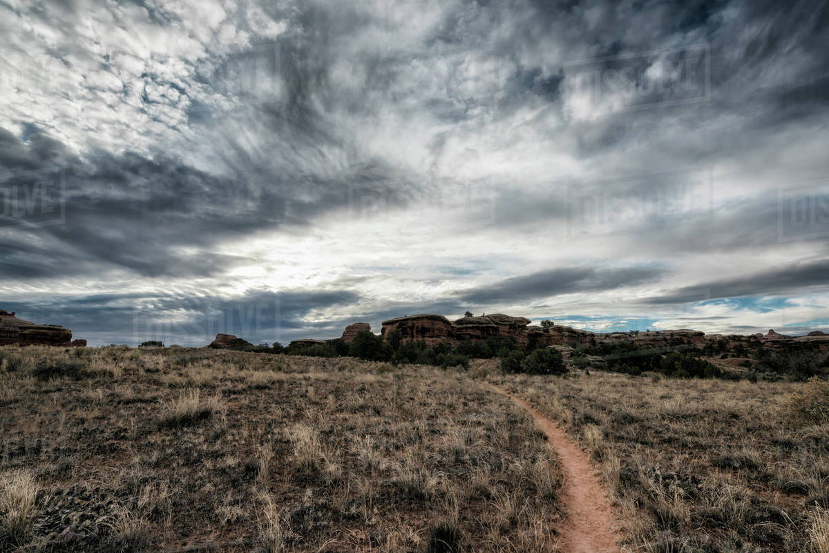 Clouds over desert path, Moab, Utah, United States - Royalty-free Stock ...