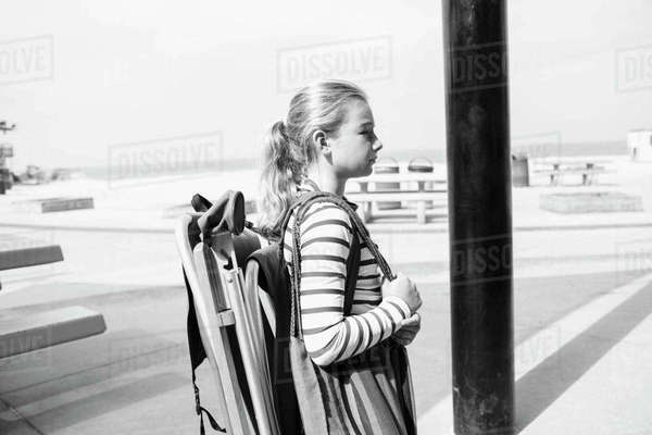 Caucasian girl carrying folding chair at beach - Royalty-free Stock ...