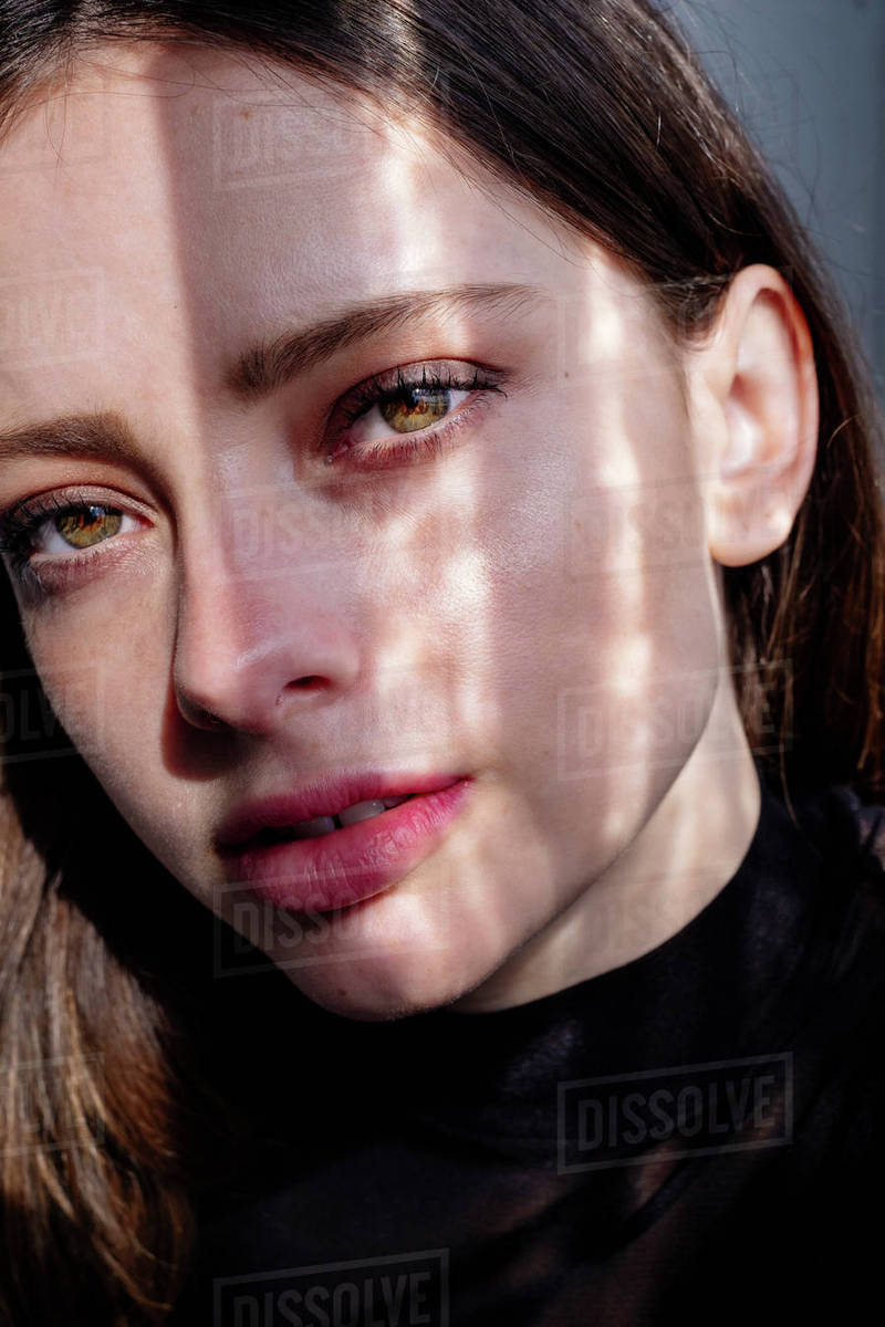 Shadow on face of serious Caucasian woman - Royalty-free Stock Photo ...