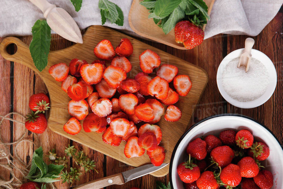 Close up of sliced strawberries on cutting board - Royalty-free Stock ...