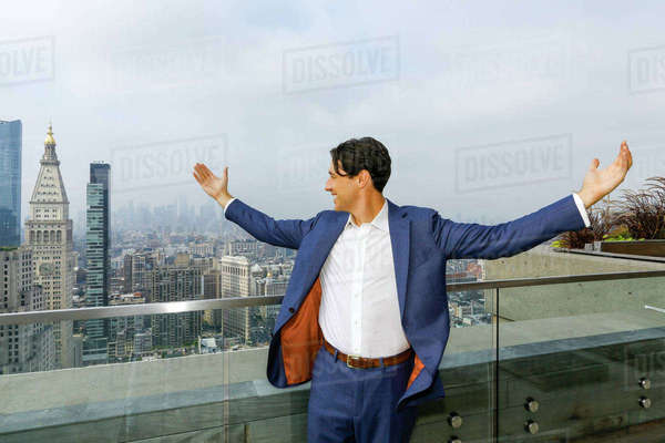 Caucasian businessman celebrating on urban rooftop - Royalty-free Stock ...