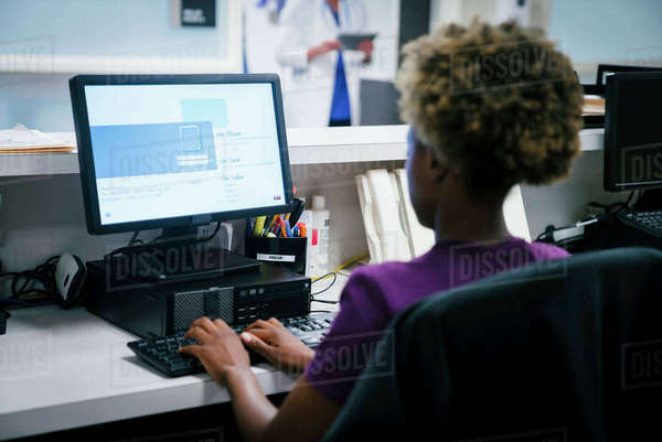 Nurse using computer in hospital - Royalty-free Stock Photo | Dissolve