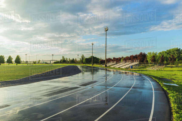 Wet bleachers and running track - Royalty-free Stock Photo | Dissolve
