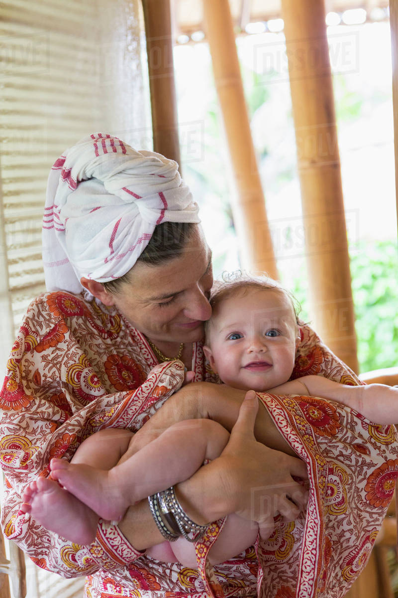 Caucasian mother cradling baby - Royalty-free Stock Photo | Dissolve