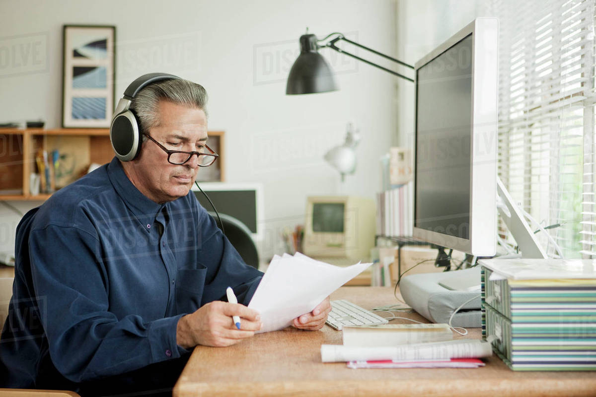 Business people working in busy office - Stock Photo - Dissolve