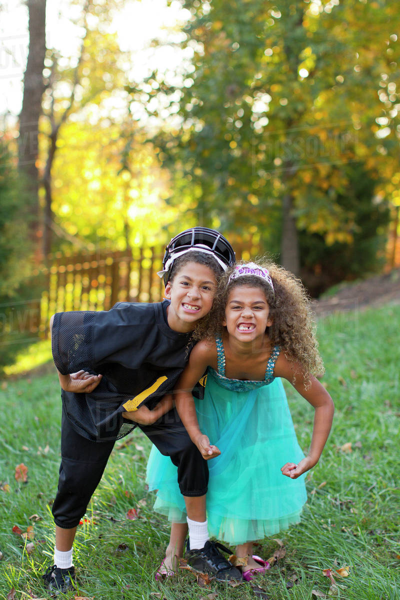 Mixed race children playing together outdoors - Stock Photo - Dissolve