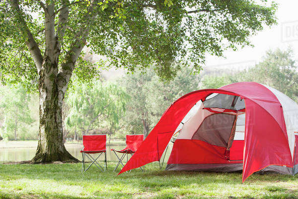 Lawn chairs and tent at campsite - Royalty-free Stock Photo | Dissolve
