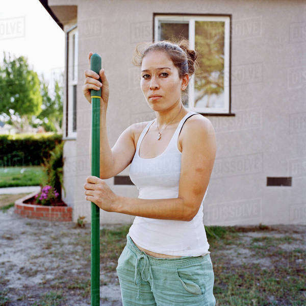 Woman working in yard - Royalty-free Stock Photo | Dissolve