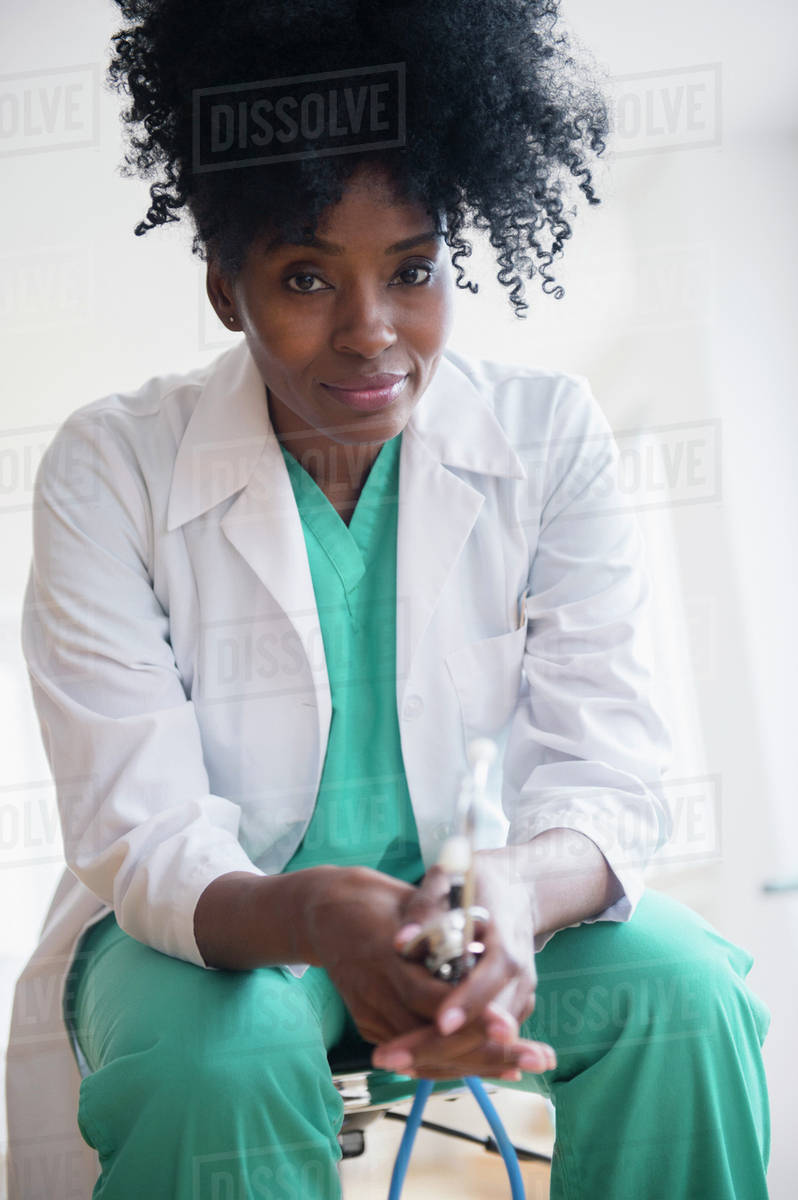 Black doctor holding stethoscope - Royalty-free Stock Photo | Dissolve