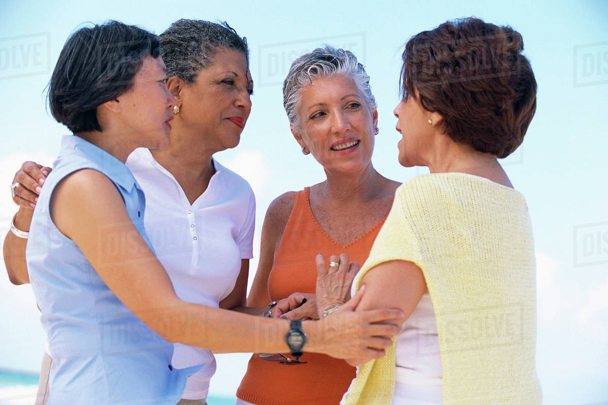 Senior women talking outdoors - Stock Photo - Dissolve