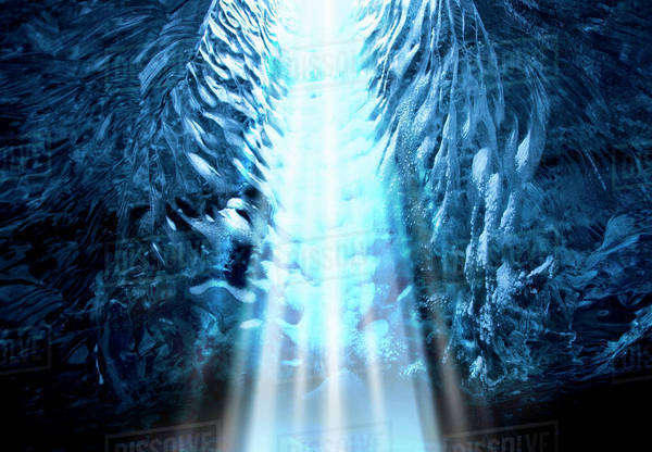 Light shining into ice cave - Royalty-free Stock Photo | Dissolve