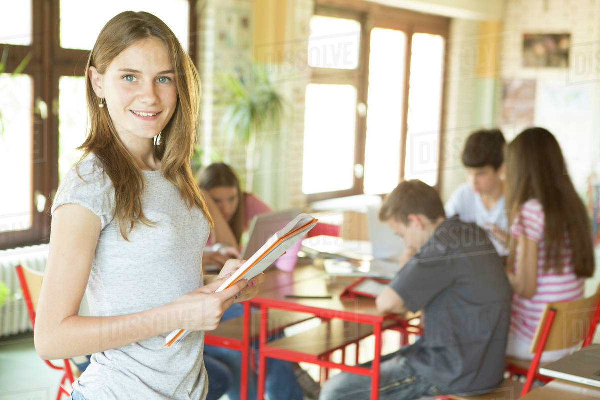 Student carrying notebooks in school cafeteria - Royalty-free Stock ...