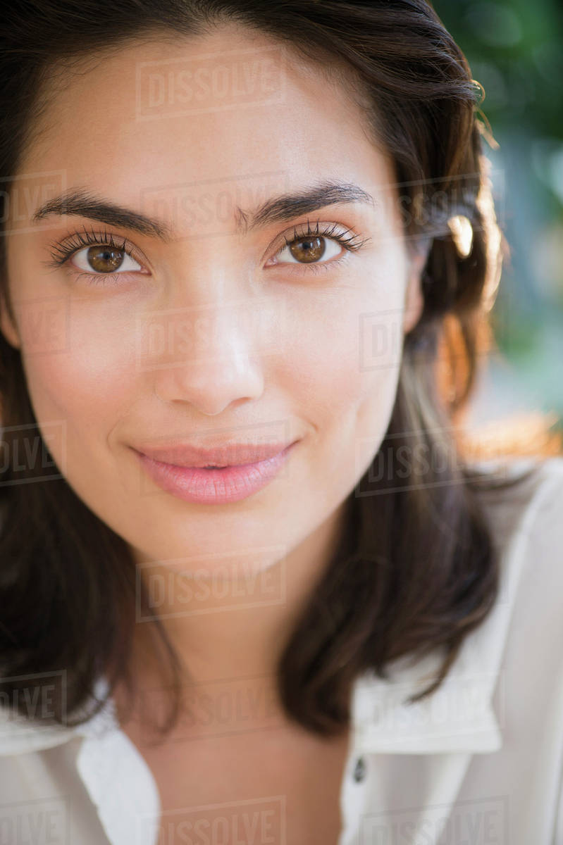 Hispanic woman smiling - Royalty-free Stock Photo | Dissolve