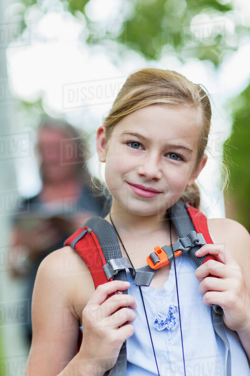 Caucasian girl hiking with backpack - Royalty-free Stock Photo | Dissolve
