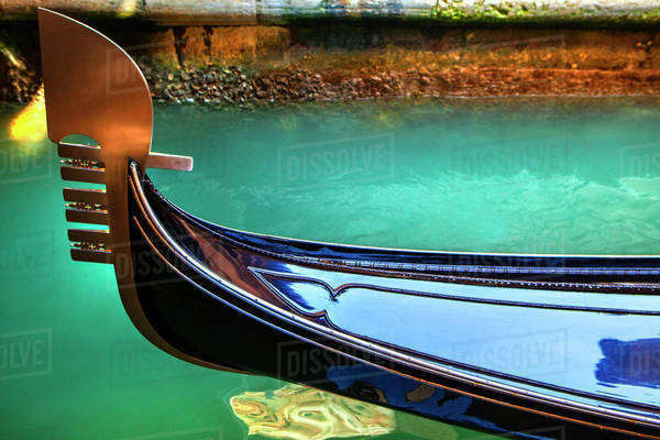 Close up of ornate gondola decoration on canal - Stock Photo - Dissolve