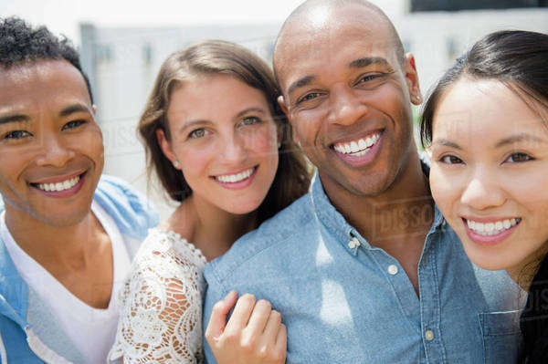 Friends smiling at party - Royalty-free Stock Photo | Dissolve