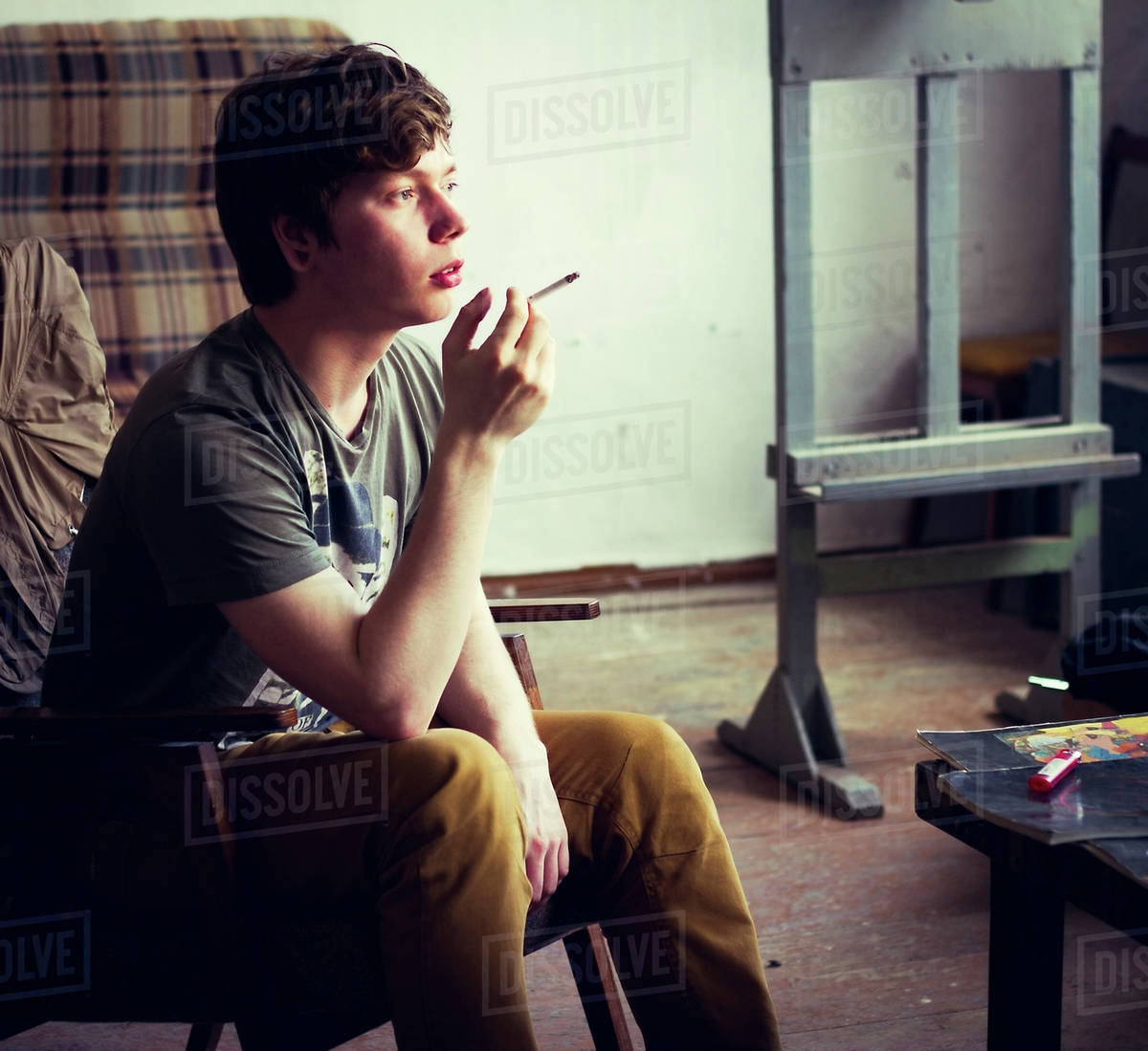 Caucasian man smoking cigarette in living room - Royalty-free Stock ...