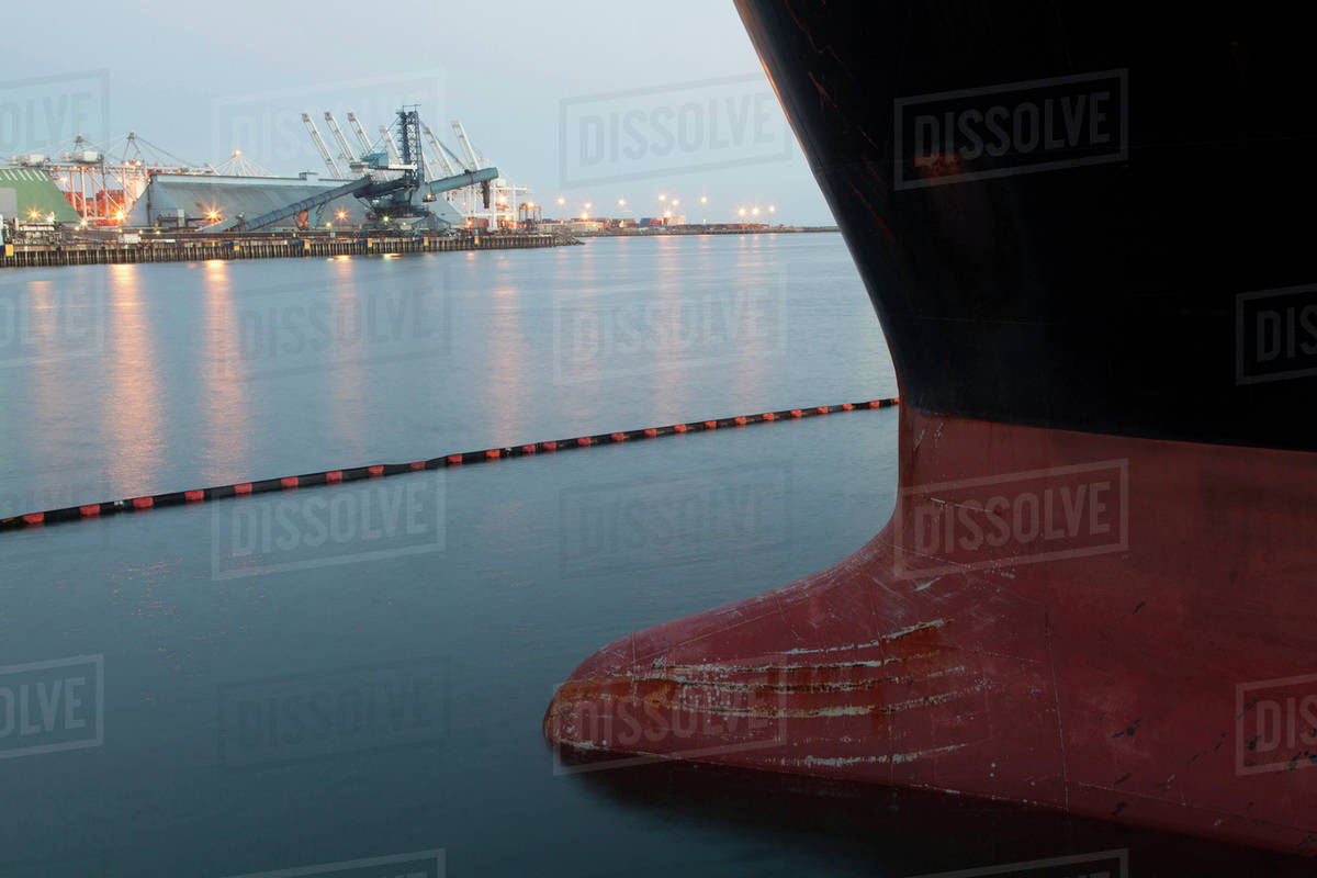 Close up of bow of ship docked in industrial harbor - Stock Photo ...