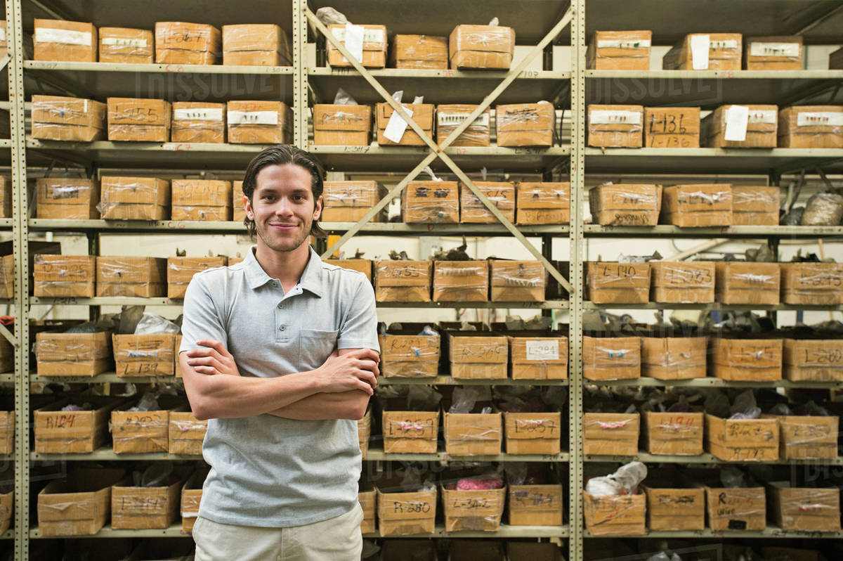 Mixed race worker smiling in textile factory - Royalty-free Stock Photo ...
