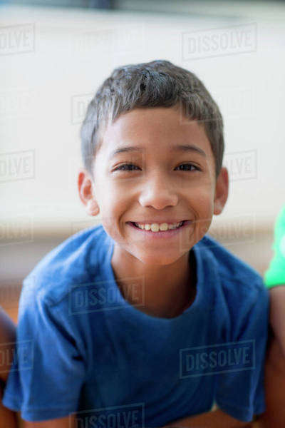 Hispanic boy smiling - Stock Photo - Dissolve