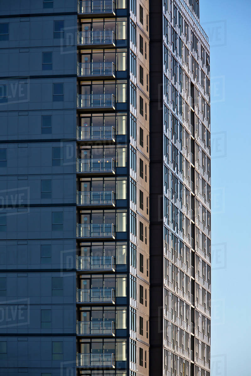 Tall Building with Outdoor Decks - Stock Photo - Dissolve