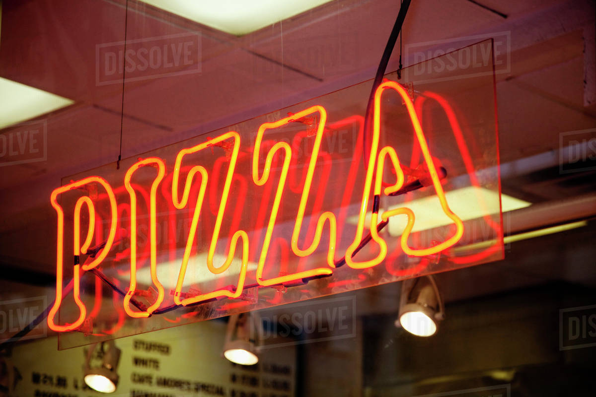 Neon Pizza Sign on Window at Night - Stock Photo - Dissolve