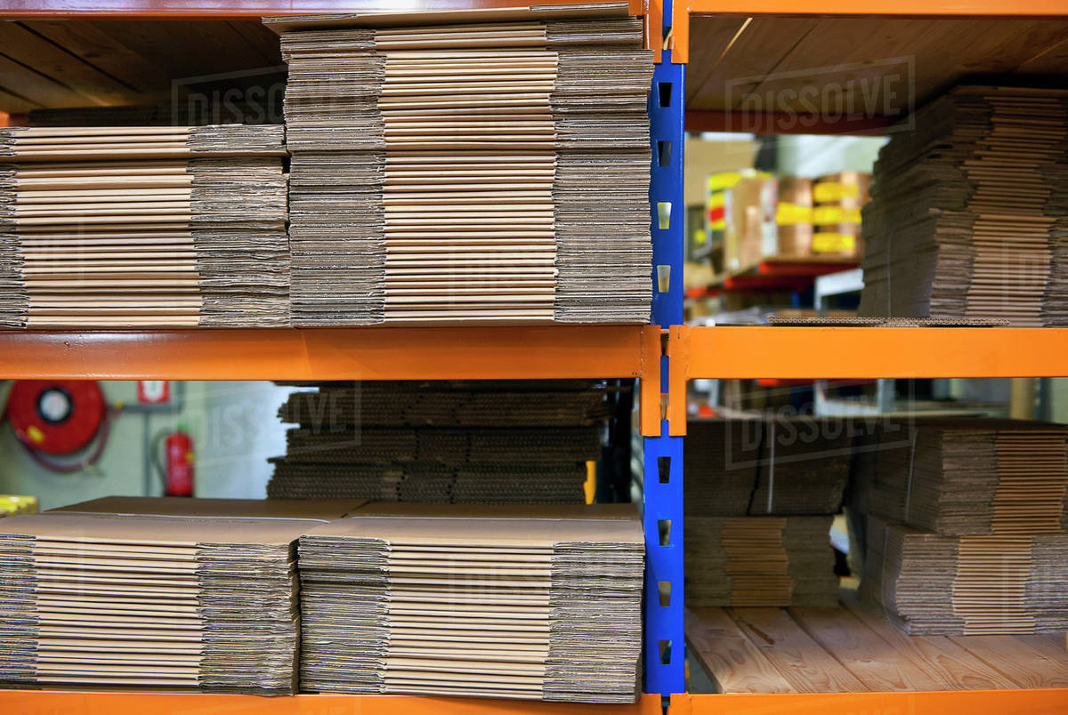 Stacks of folded cardboard boxes - Royalty-free Stock Photo | Dissolve