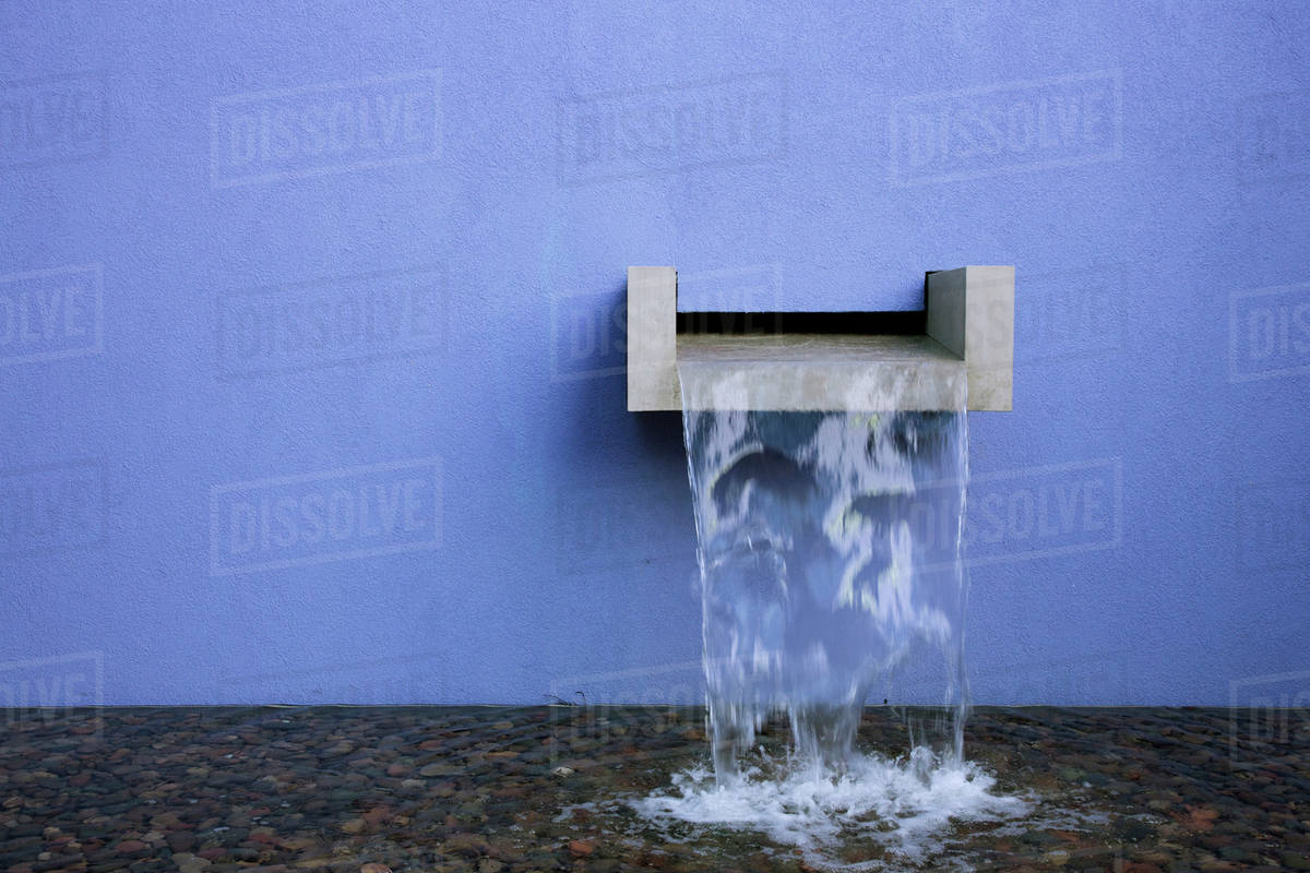 Water Pouring into Pool - Stock Photo - Dissolve
