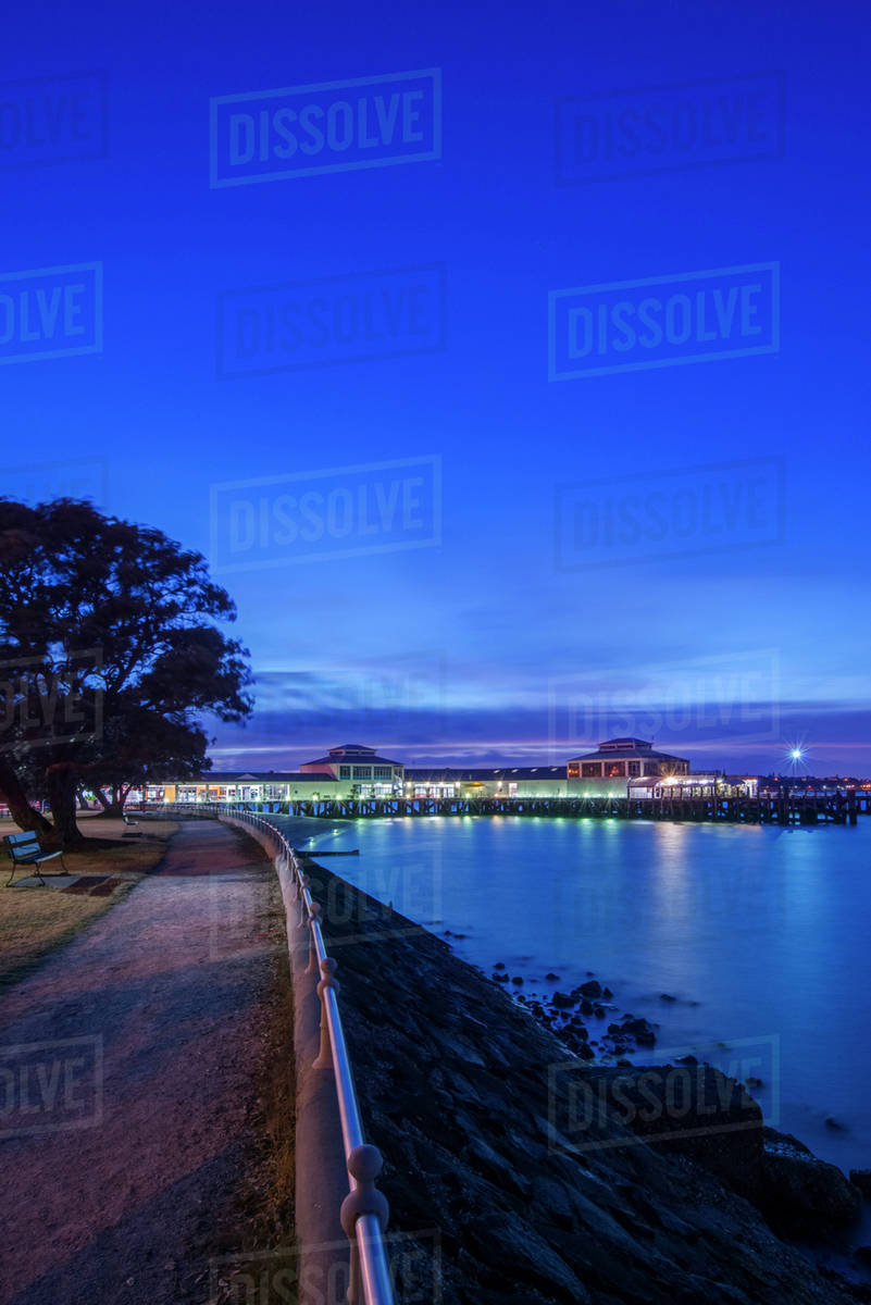 Harbor lit up at night - Stock Photo - Dissolve