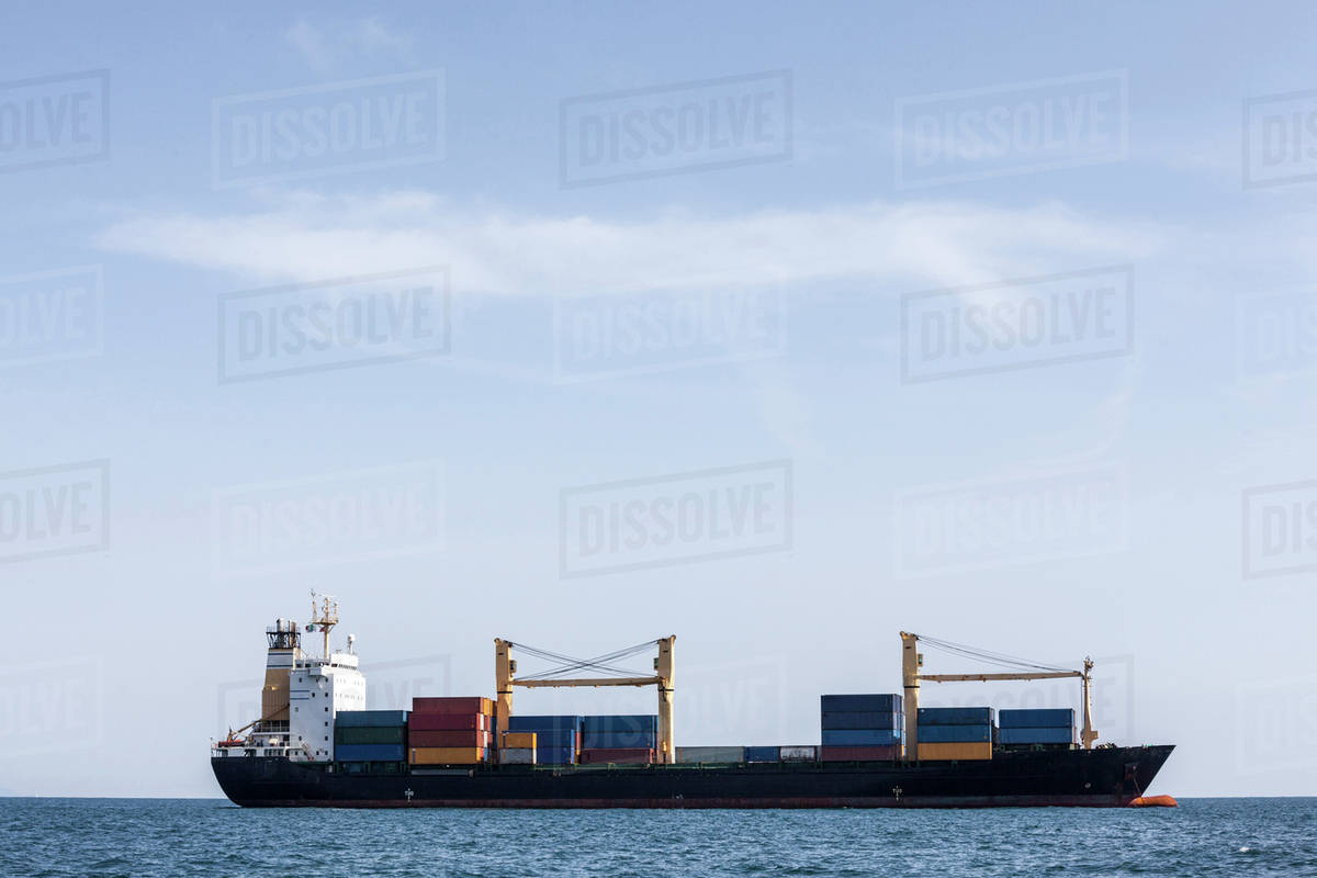 Cargo ship in ocean - Stock Photo - Dissolve