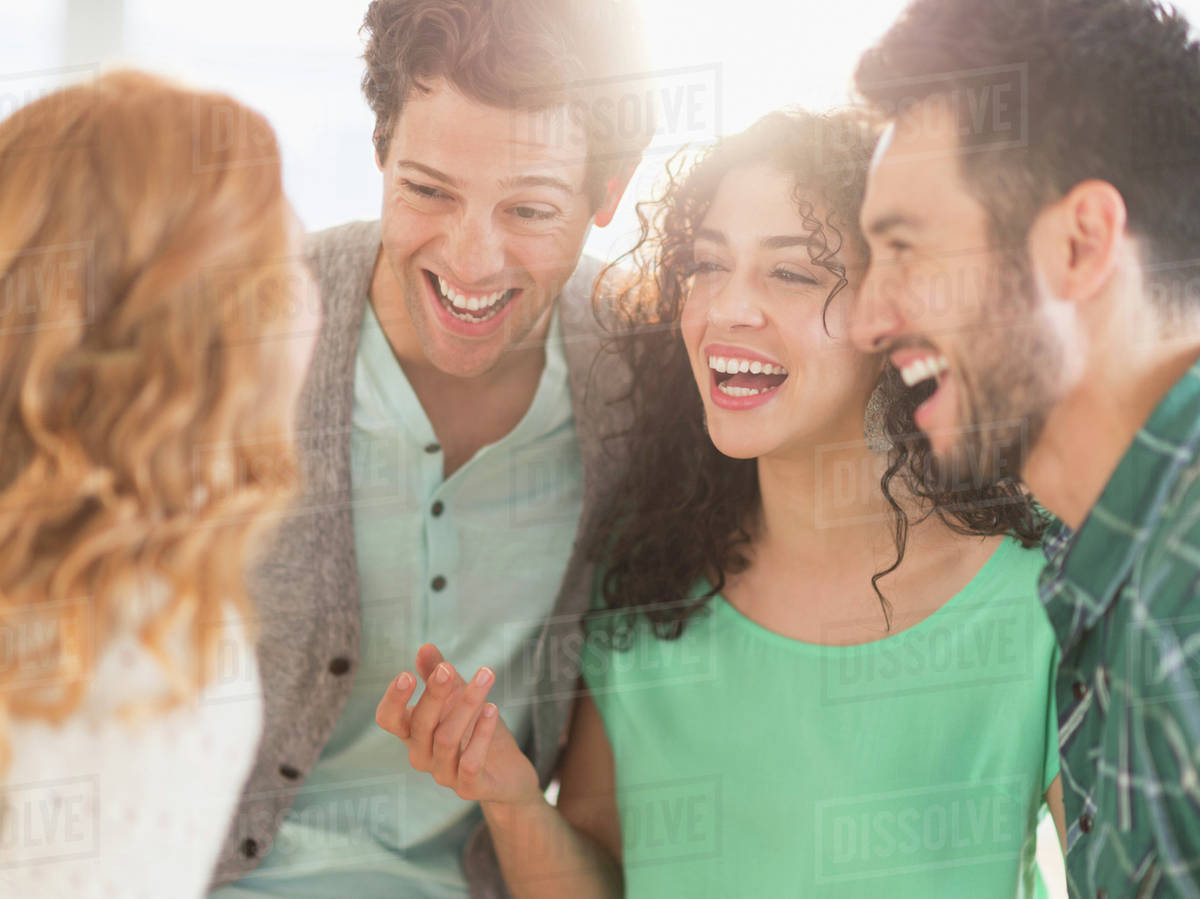 Friends laughing together - Stock Photo - Dissolve