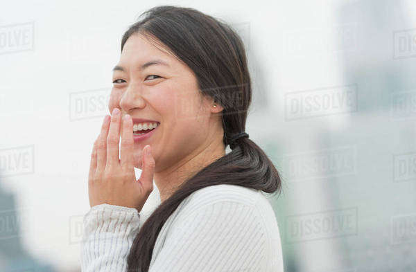 Korean woman laughing - Royalty-free Stock Photo | Dissolve