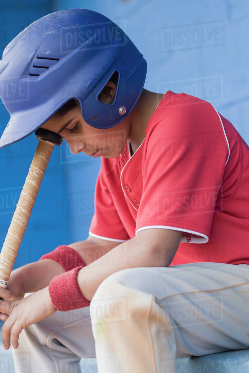 Sad Hispanic baseball player - Royalty-free Stock Photo | Dissolve