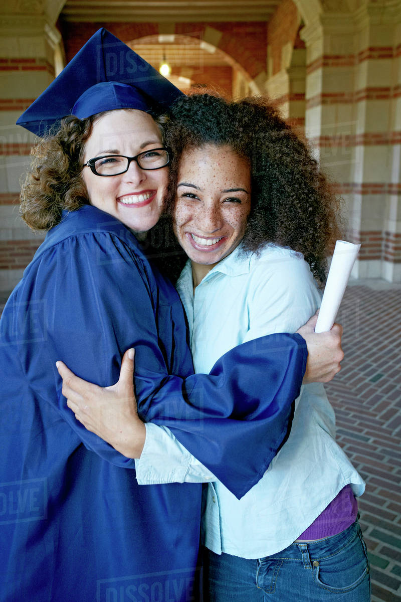 Friend hugging graduate - Royalty-free Stock Photo | Dissolve