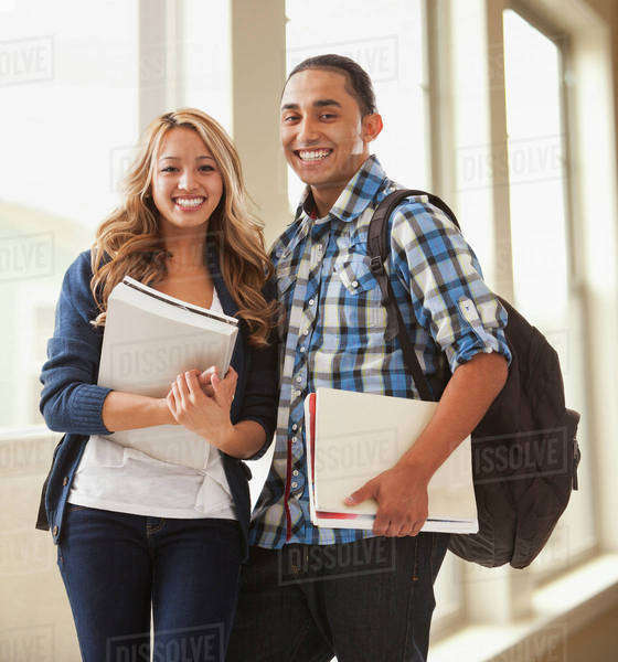 Student couple smiling on campus - Royalty-free Stock Photo | Dissolve