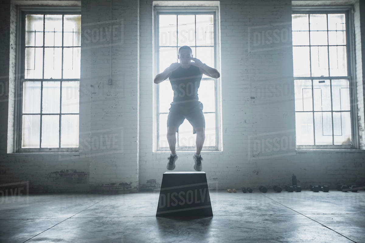 Athlete jumping on platform - Royalty-free Stock Photo | Dissolve