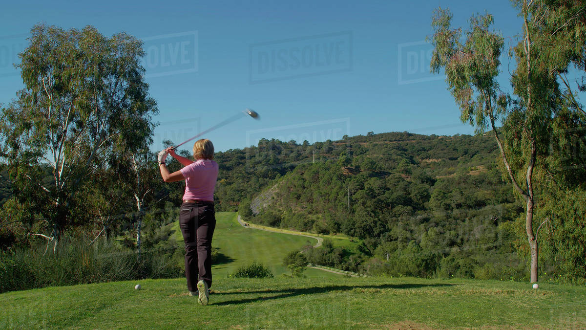Caucasian woman teeing off on golf course - Royalty-free Stock Photo ...