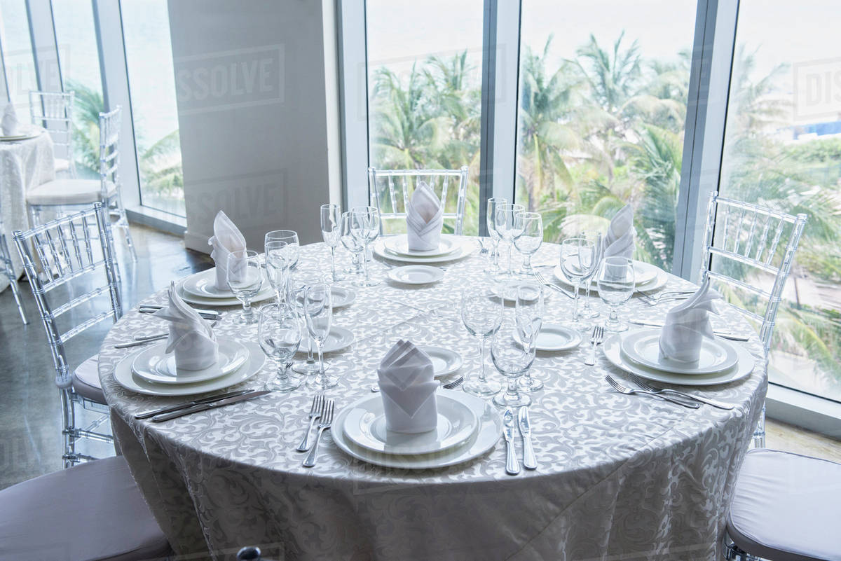 Set table at window in restaurant - Stock Photo - Dissolve