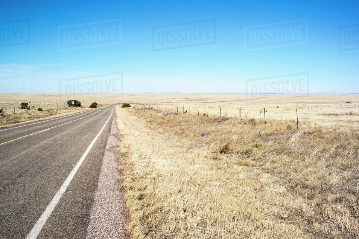 Empty road in rural landscape - Royalty-free Stock Photo | Dissolve